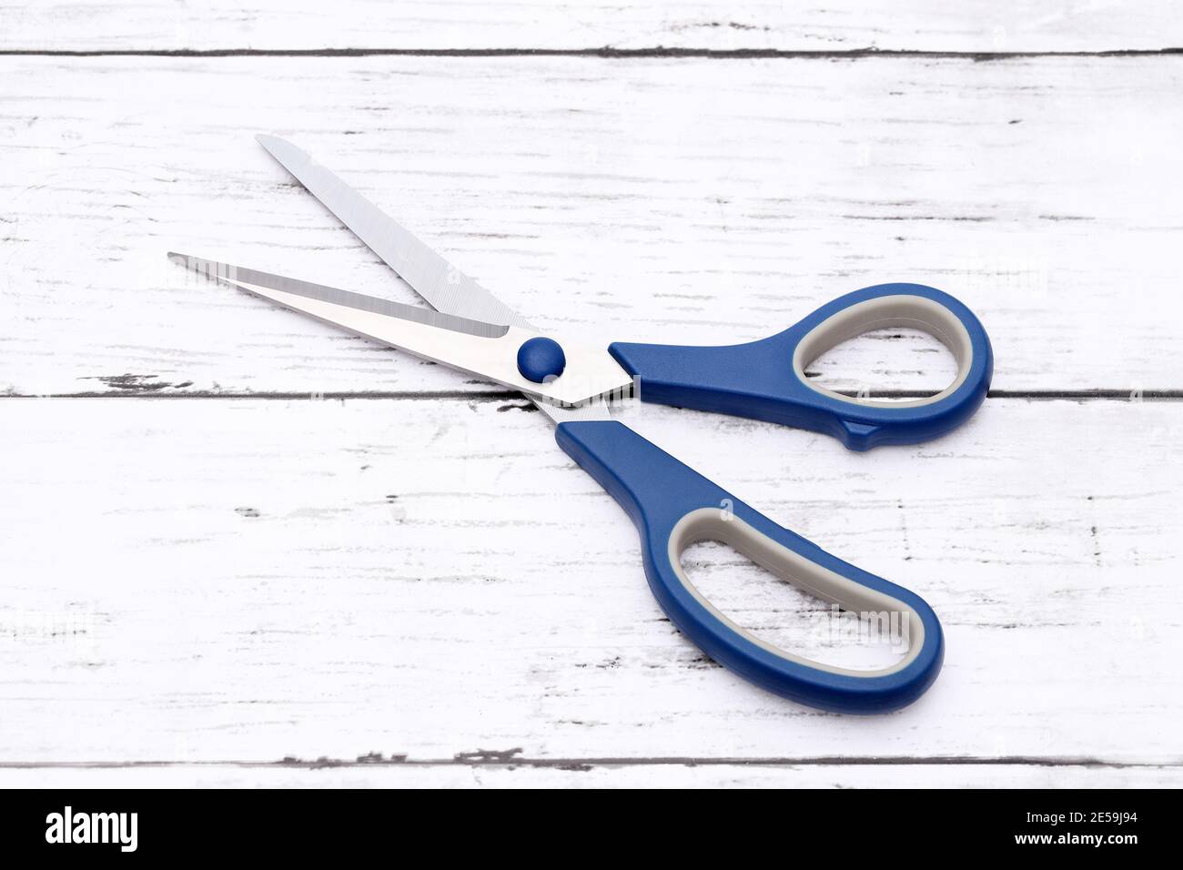Blue handle scissors hi-res stock photography and images - Alamy