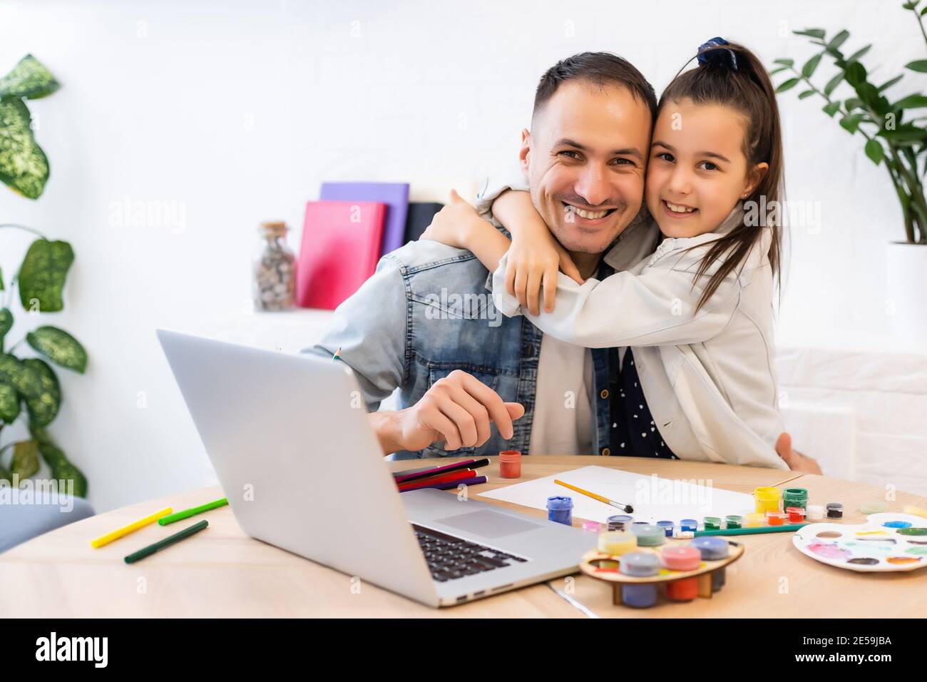 young father help little preschooler daughter studying together watch ...