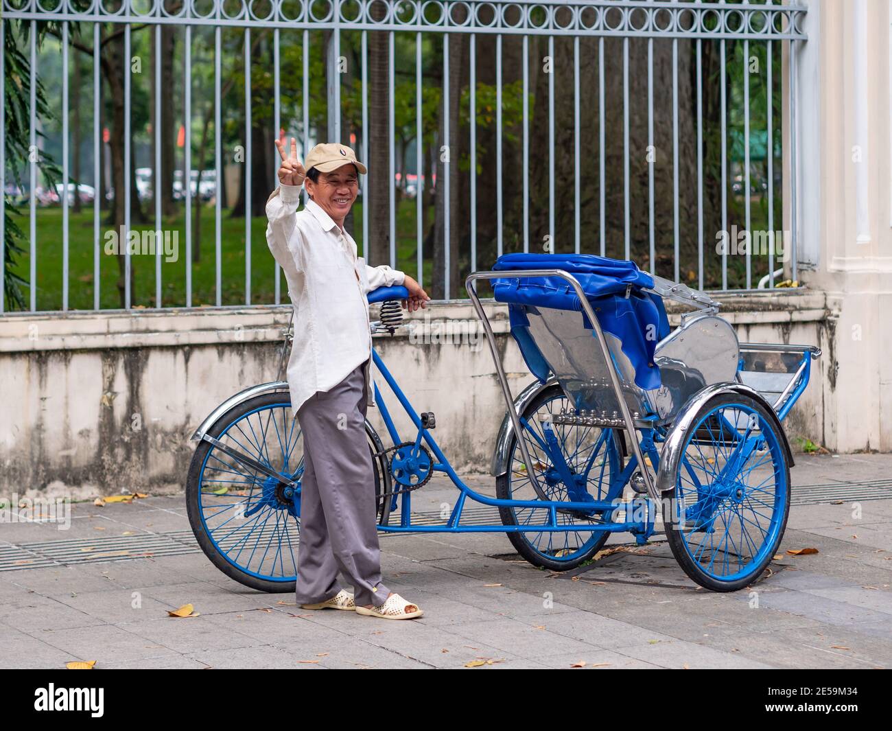 Cyclo driver in Ho Chi Minh City, Vietnam, waiting for customers ...