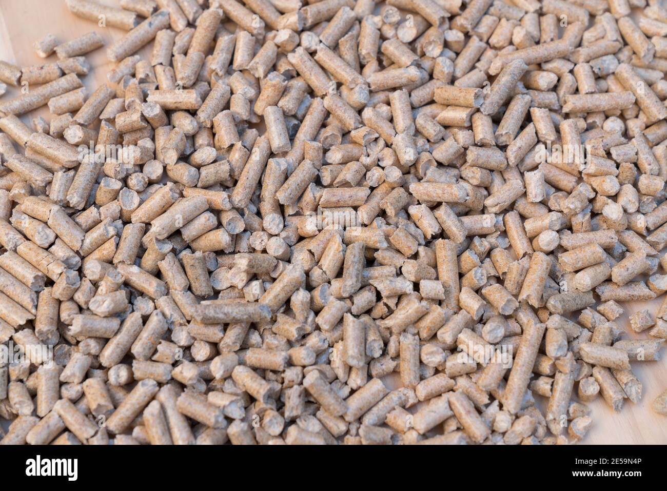 Wood pellets - log of wood with a blurred background Stock Photo - Alamy