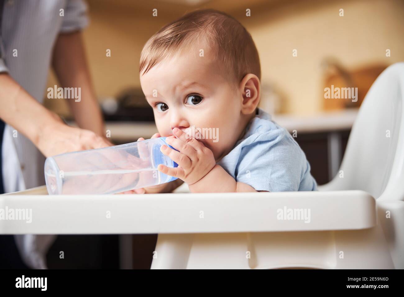Attentive baby boy staring at screen of camera Stock Photo - Alamy
