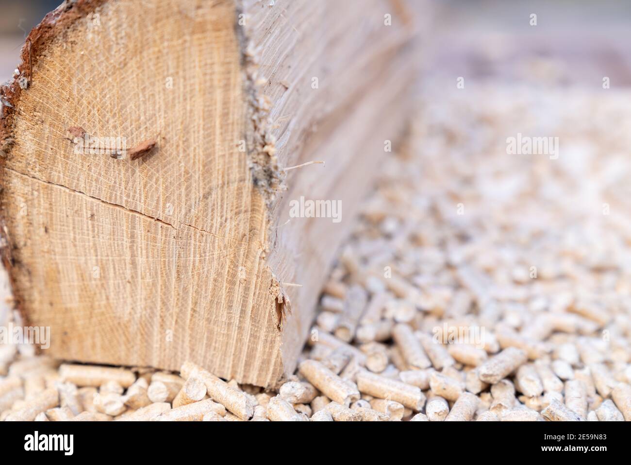 Wood pellets - log of wood with a blurred background Stock Photo - Alamy