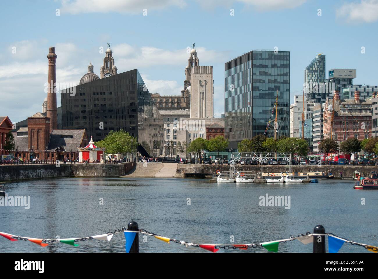 Liverpool's lively waterfront showing the mix of old and new buildings ...