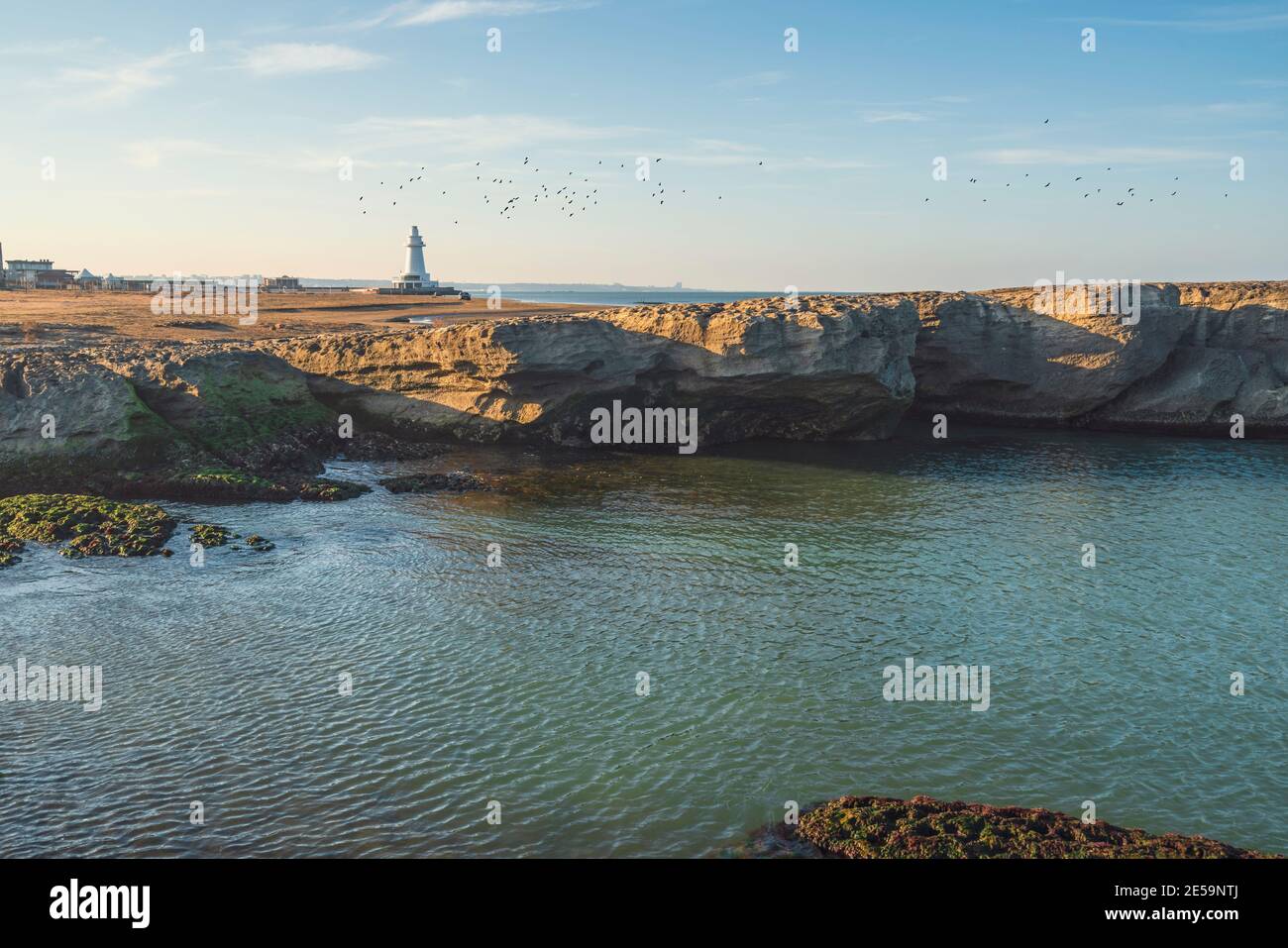 Lighthouse by the seashore hi-res stock photography and images - Alamy