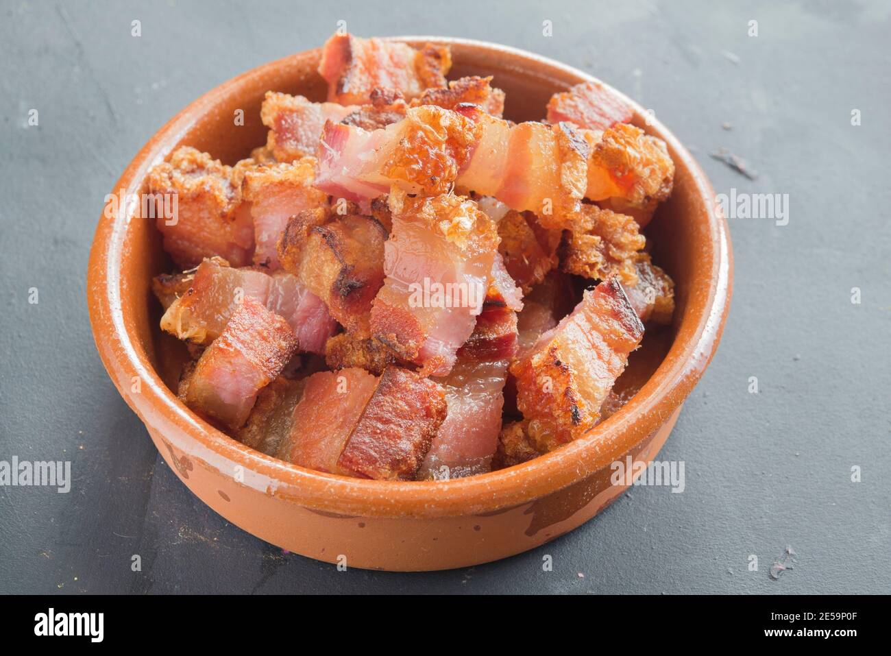 slice of bacon tapa typical spanish food Stock Photo - Alamy
