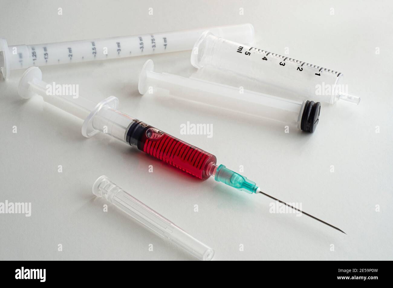 Drop of red blood fluid isolated on white background, corona virus test ...