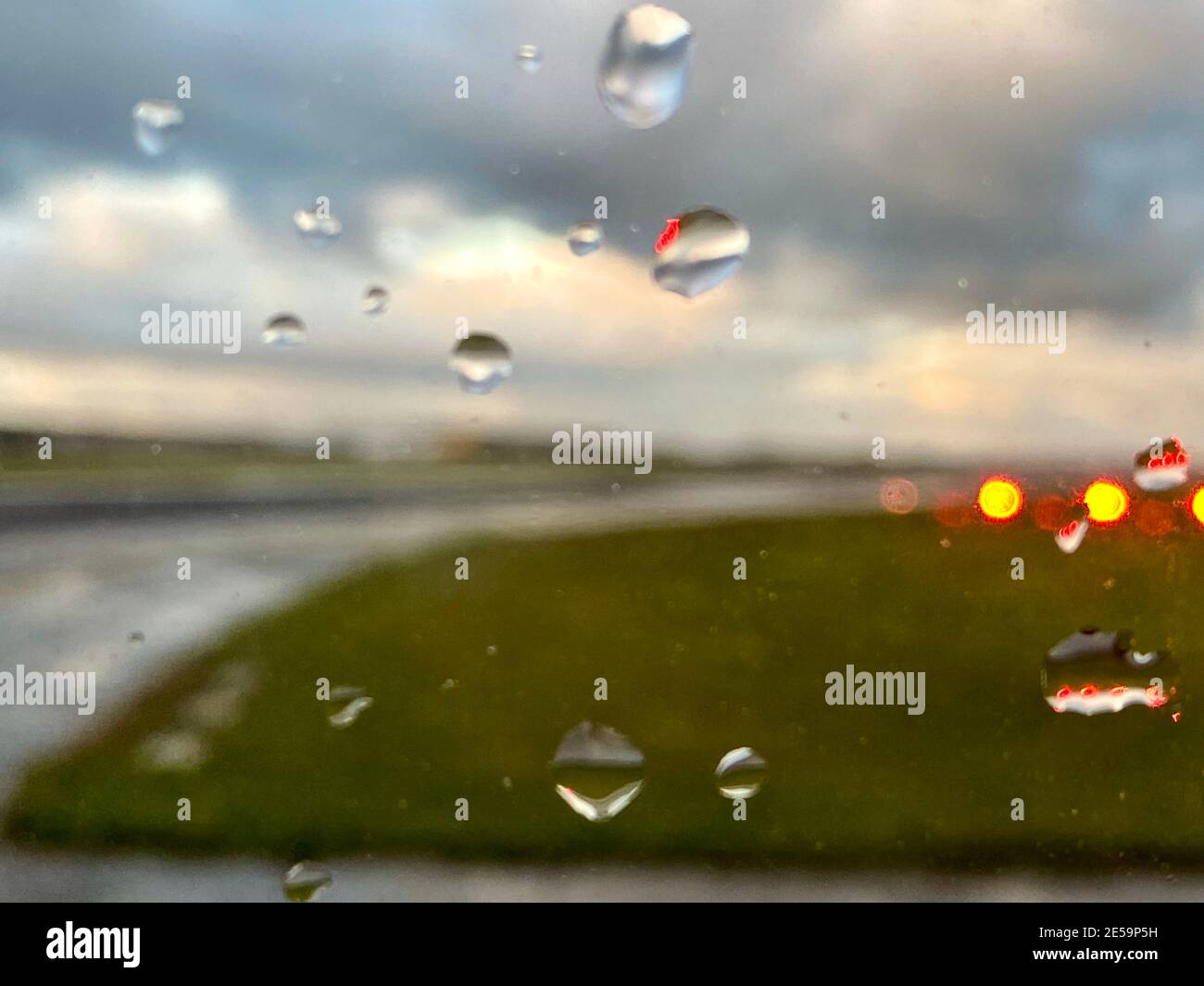 Taxiing at the airport on a bad weather rainy day. Looking out aircraft ...