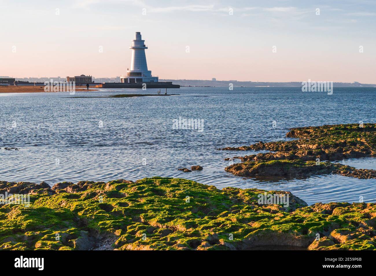 Lighthouse on seashore, marine navigation Stock Photo - Alamy