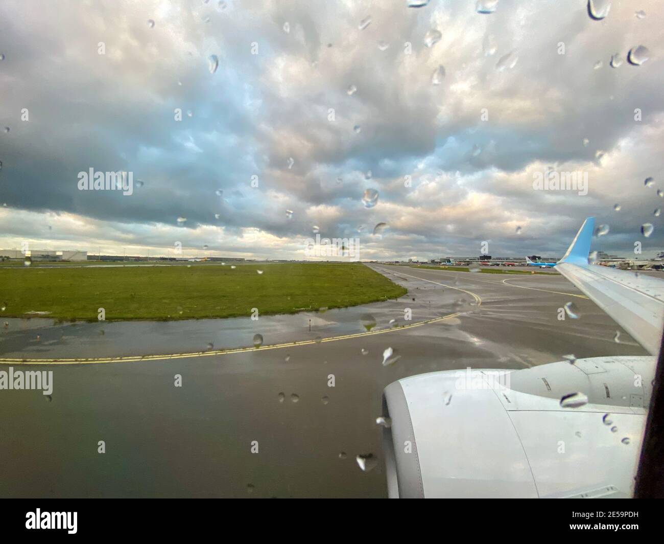 Taxiing at the airport on a bad weather rainy day. Looking out aircraft ...
