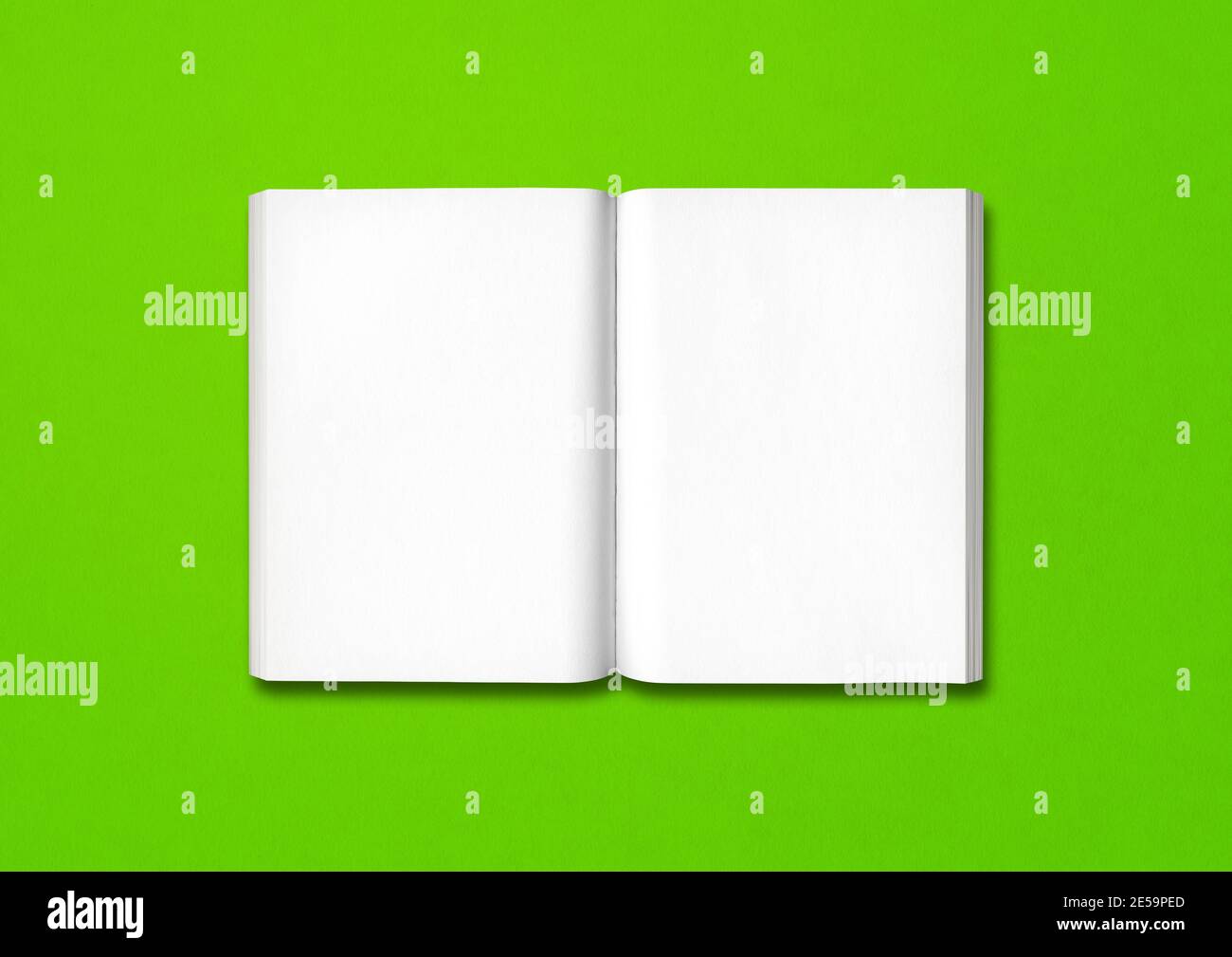 Open book isolated on a green background Stock Photo - Alamy