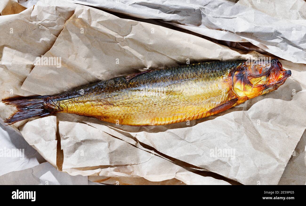 Smoked herring on brown paper Stock Photo - Alamy