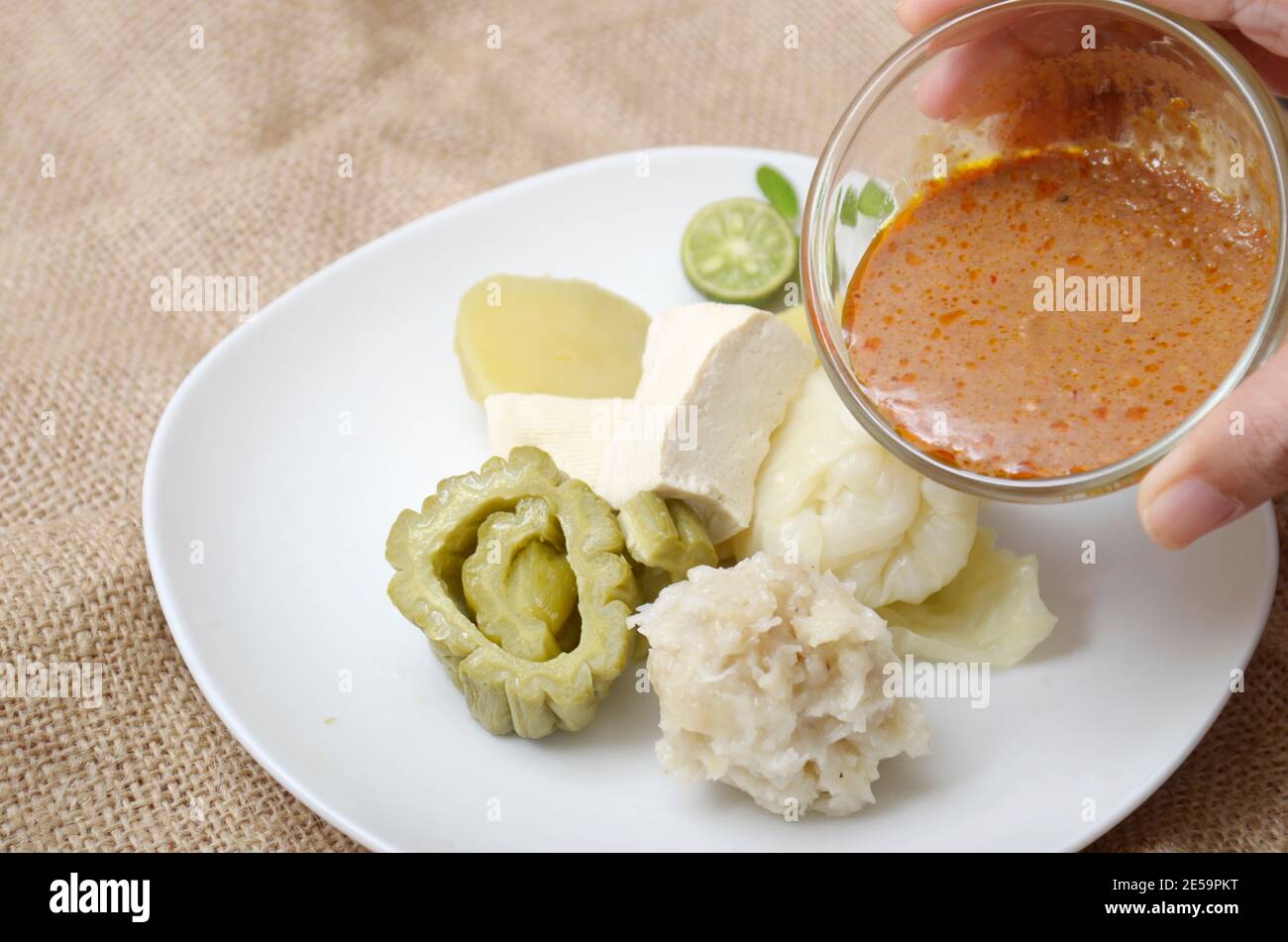 Siomay is an Indonesian steamed fish dumpling with vegetables served in ...