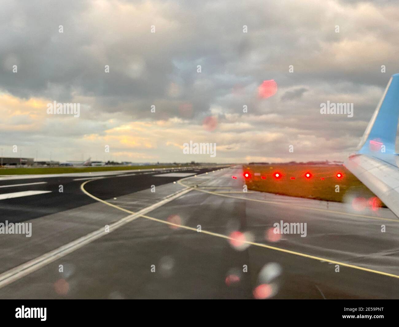 Ready for takeoff at the airport on a bad weather rainy day. Looking ...