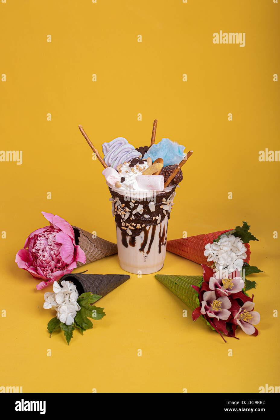 Ice cream cones with bouquets of flowers and a milkshake . Spring ...