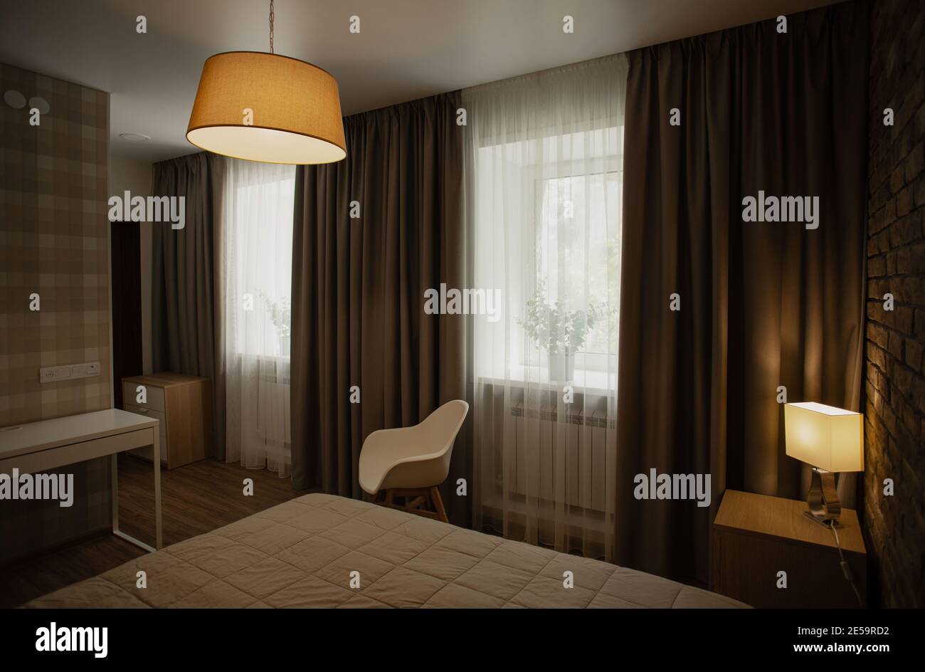 Interior of a comfortable hotel bedroom in the morning in luxury style ...