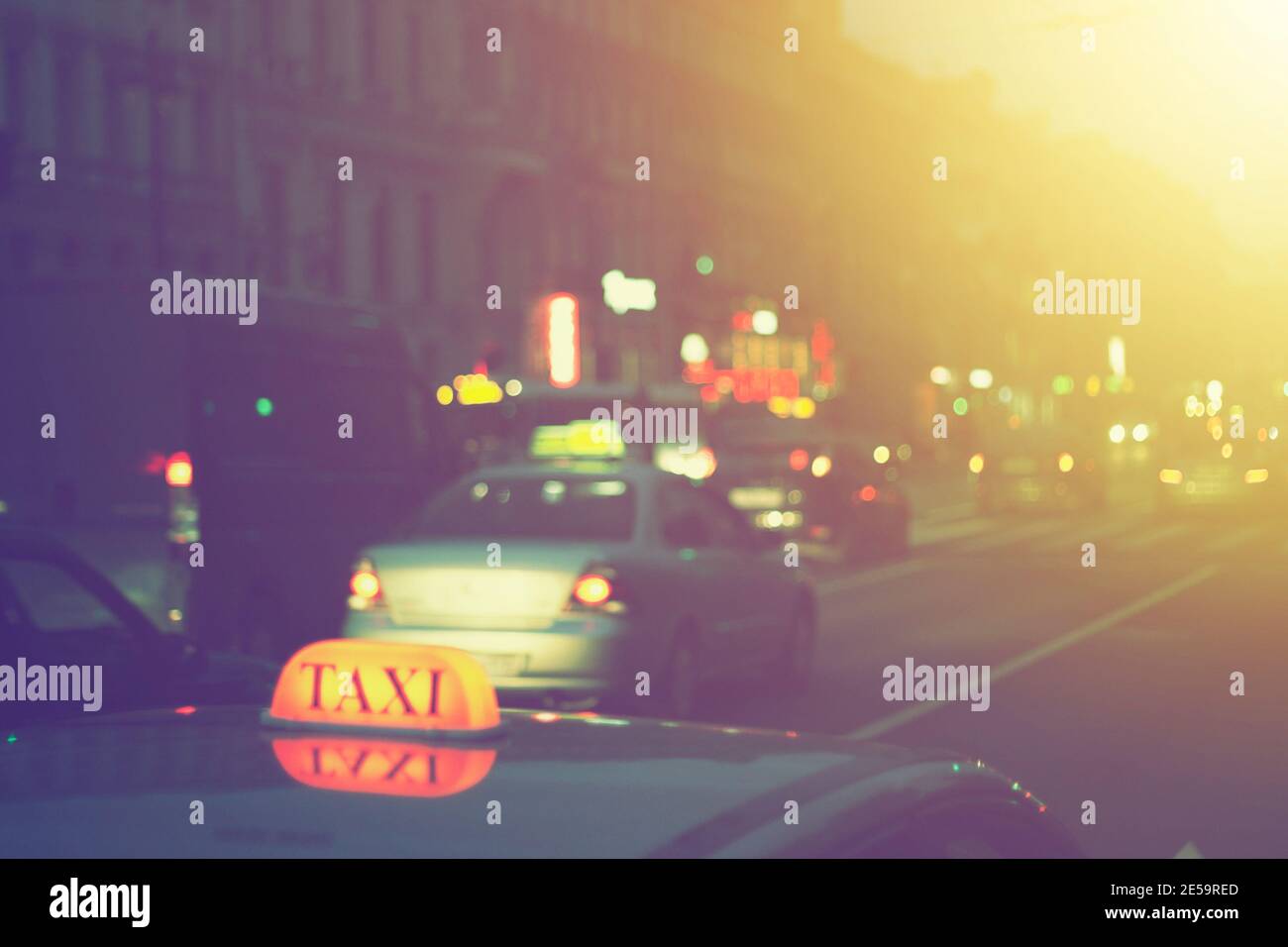 blurred background - car on a city road at sunrise Stock Photo - Alamy