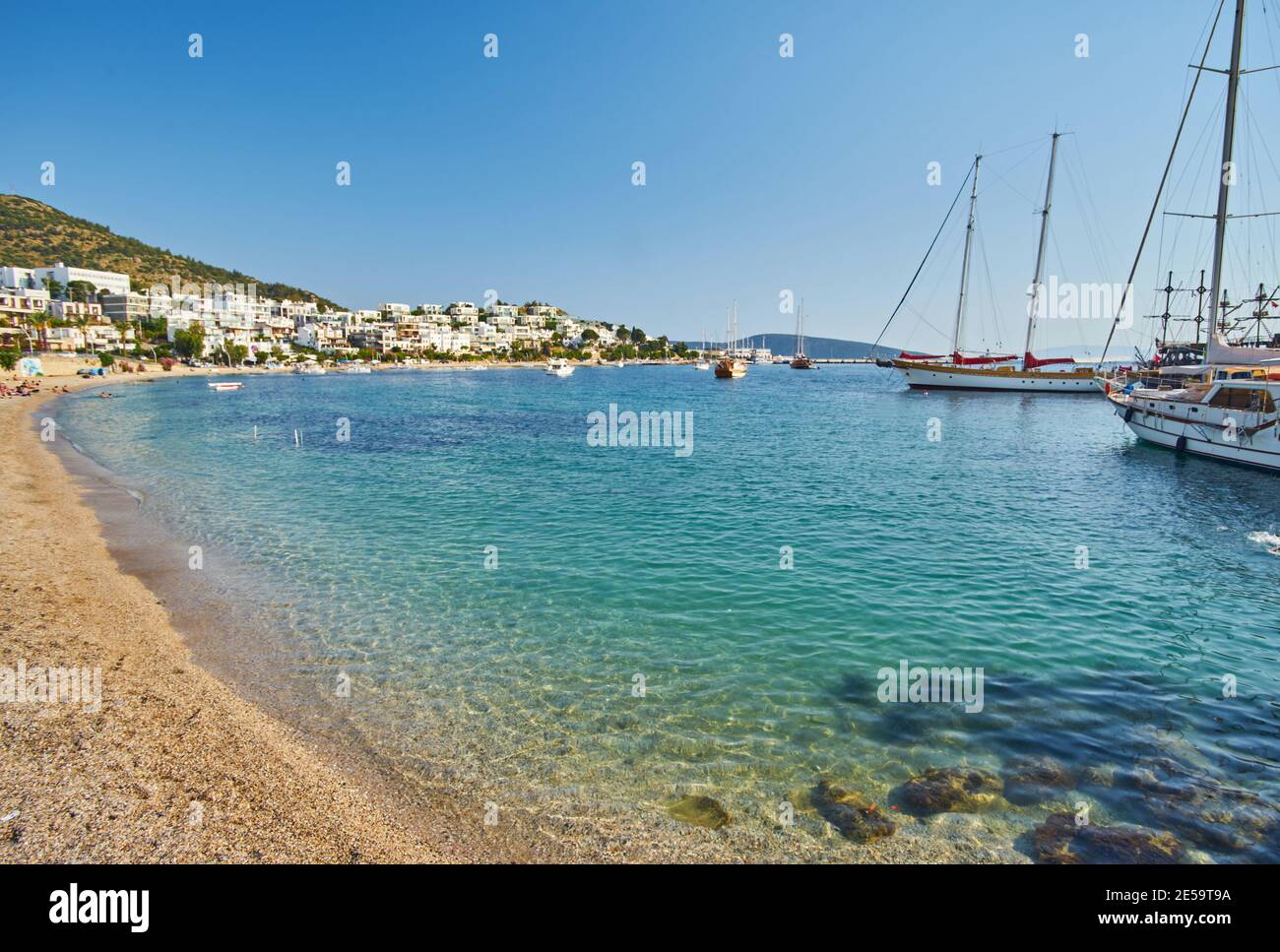 View of Bodrum Beach, Aegean sea, traditional white houses, flowers ...