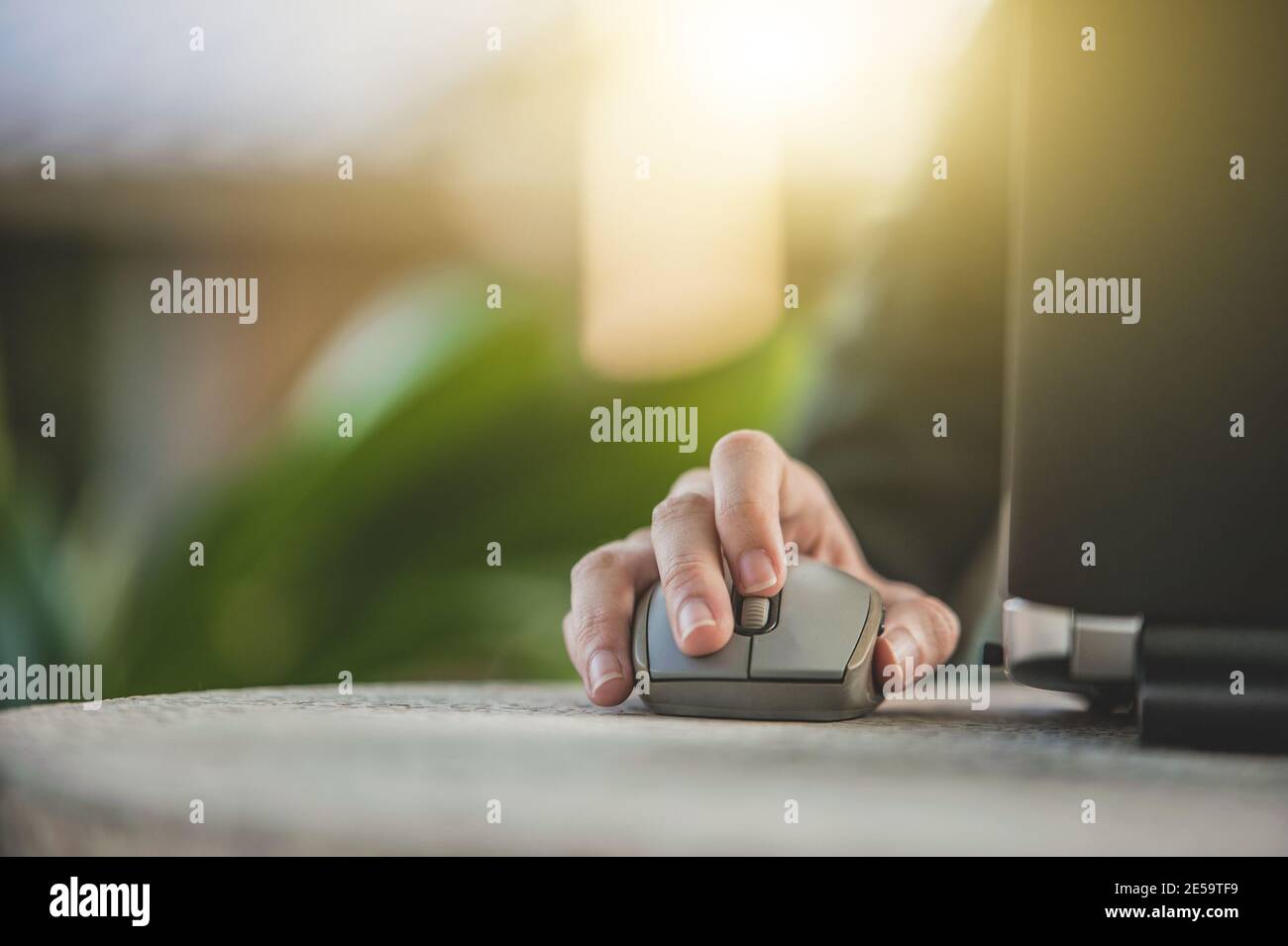 Hand use mouse laptop computer Stock Photo - Alamy