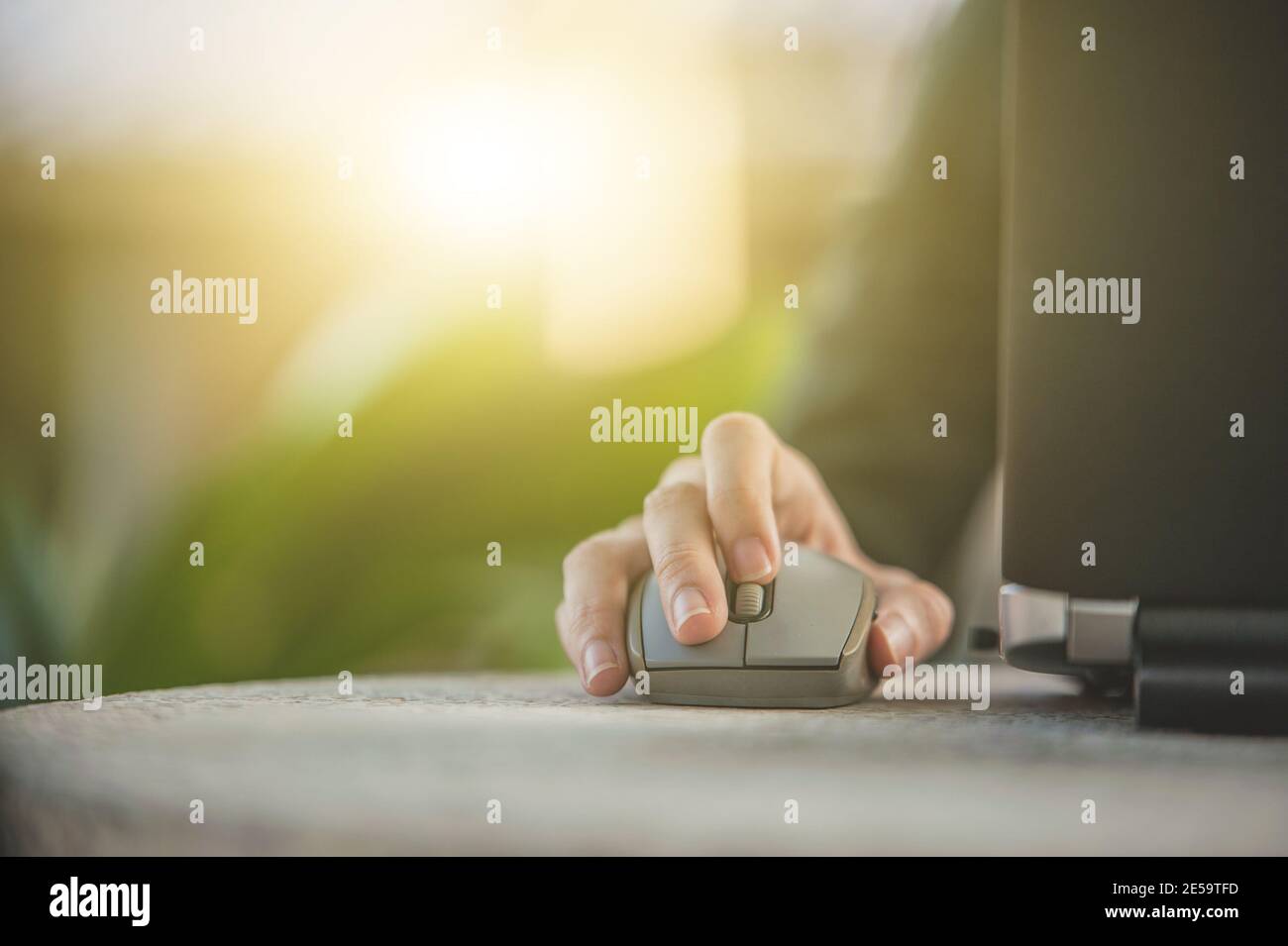 Hand use mouse laptop computer Stock Photo - Alamy