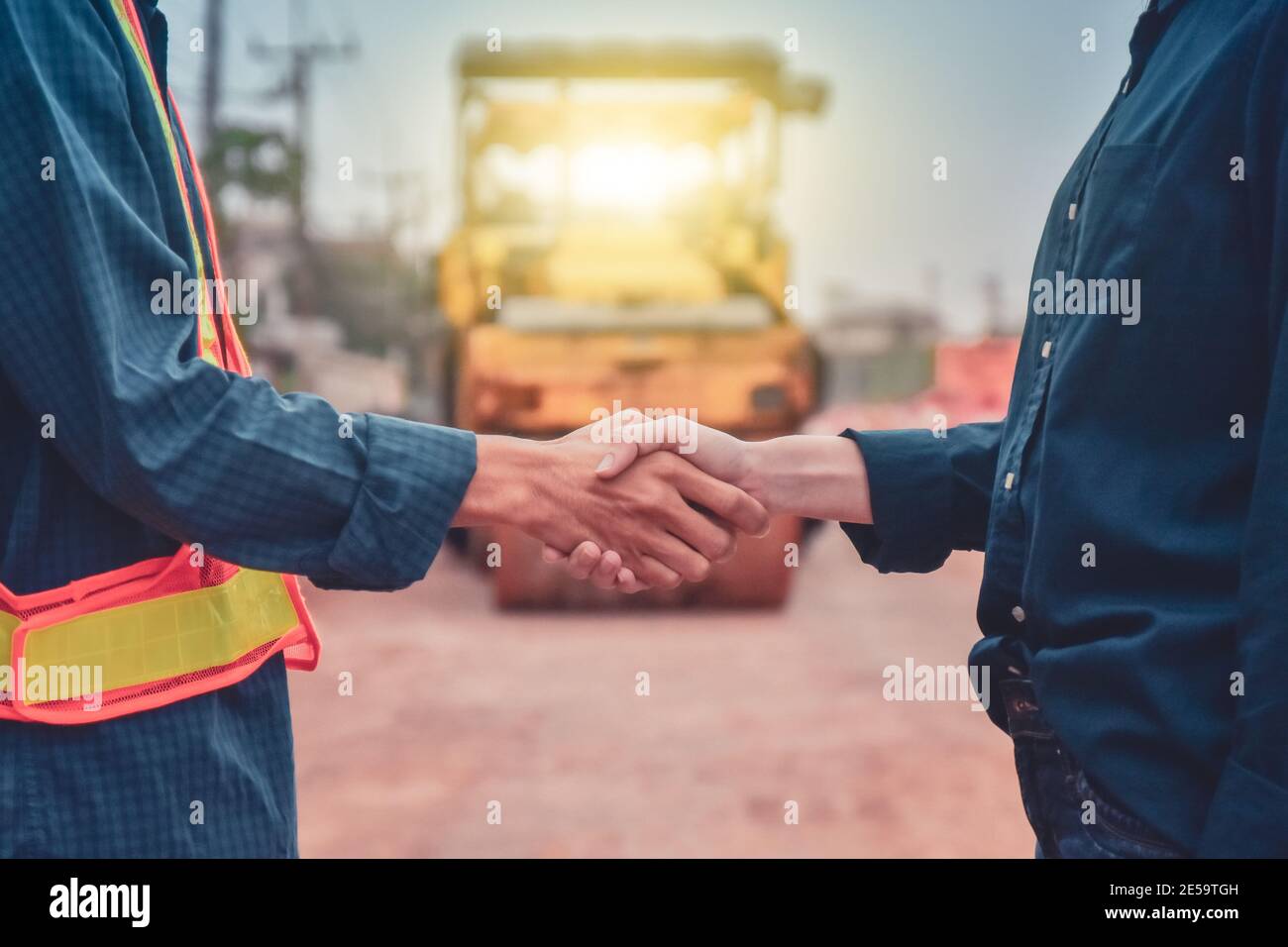 Engineer teamwork shake hand on site construction Stock Photo - Alamy