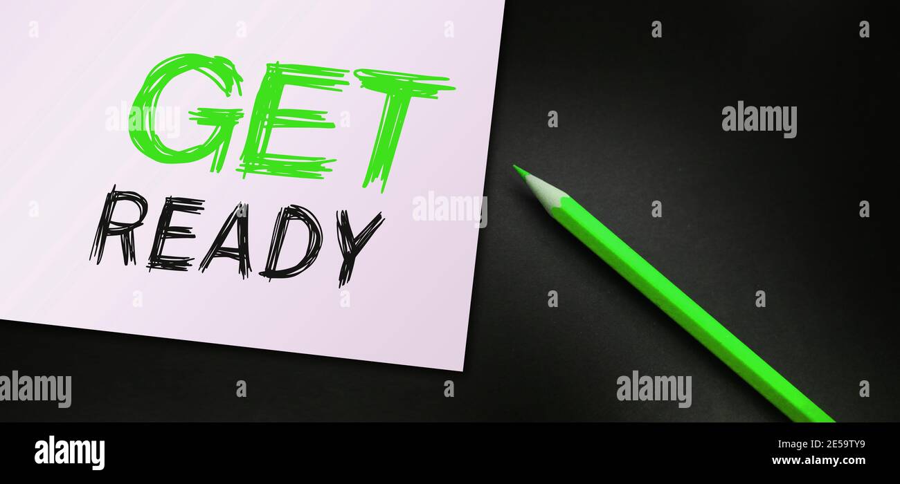 Notebook with GET READY words with pencil on black table. business ...