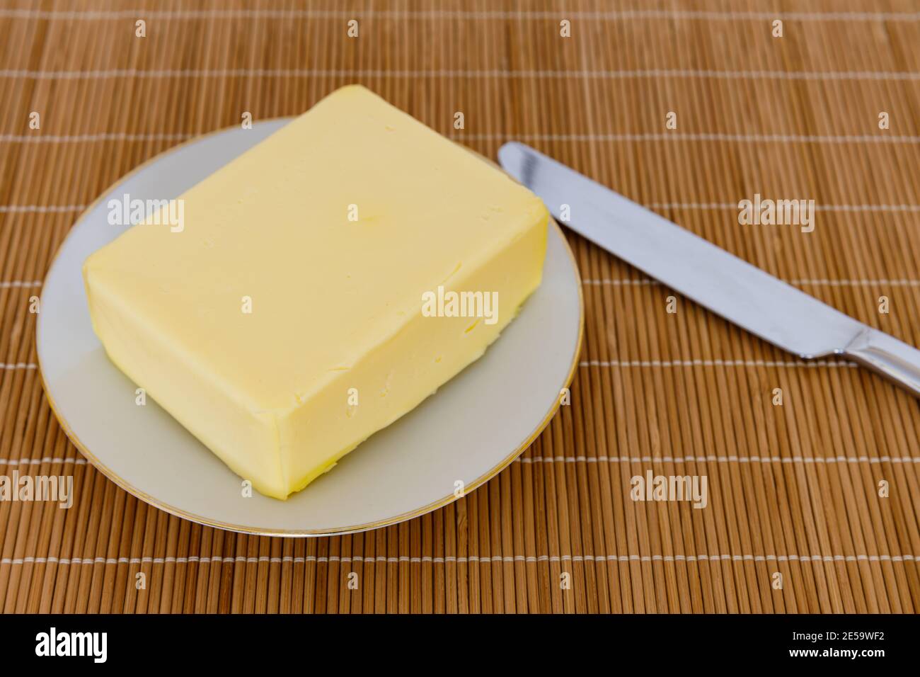 A piece of butter for breakfast Stock Photo - Alamy