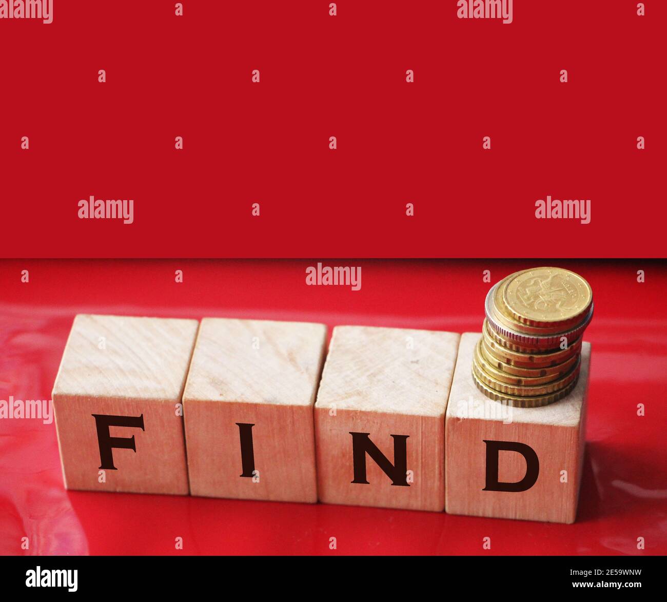 Find word Word Written In Wooden Cubes and coins. Business concept ...