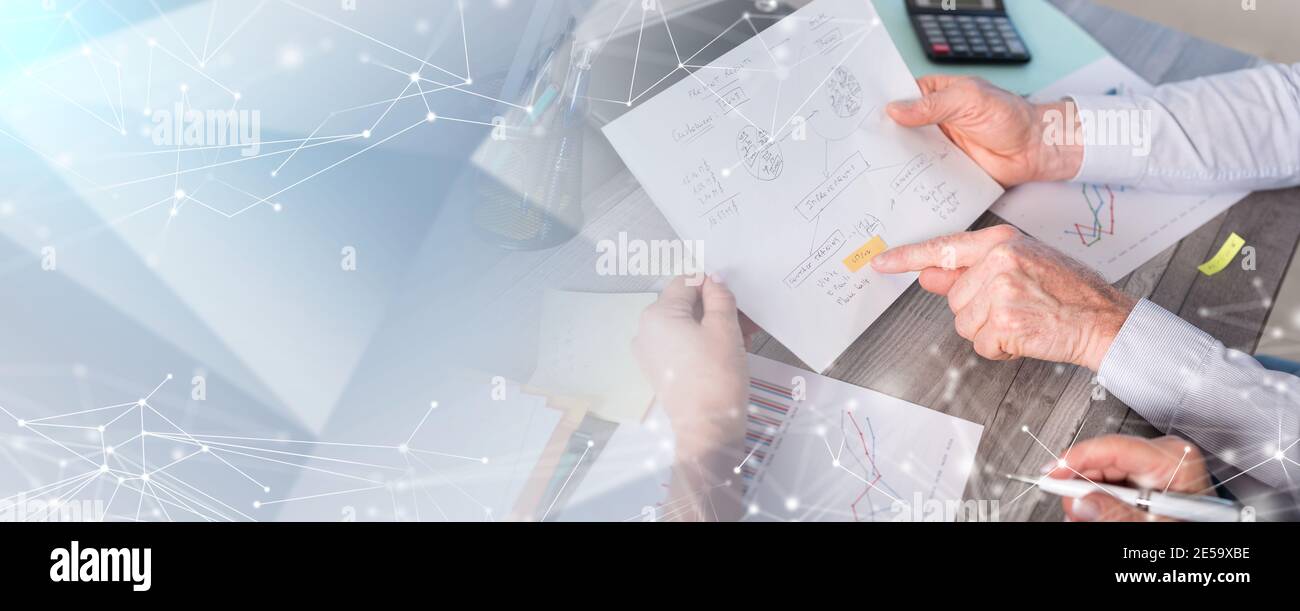 Two business people working together in office; panoramic banner Stock ...