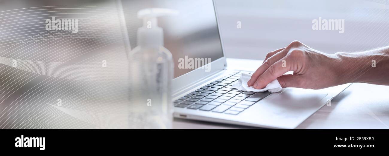 Woman disinfecting laptop keyboard with antibacterial wipe; prevention ...