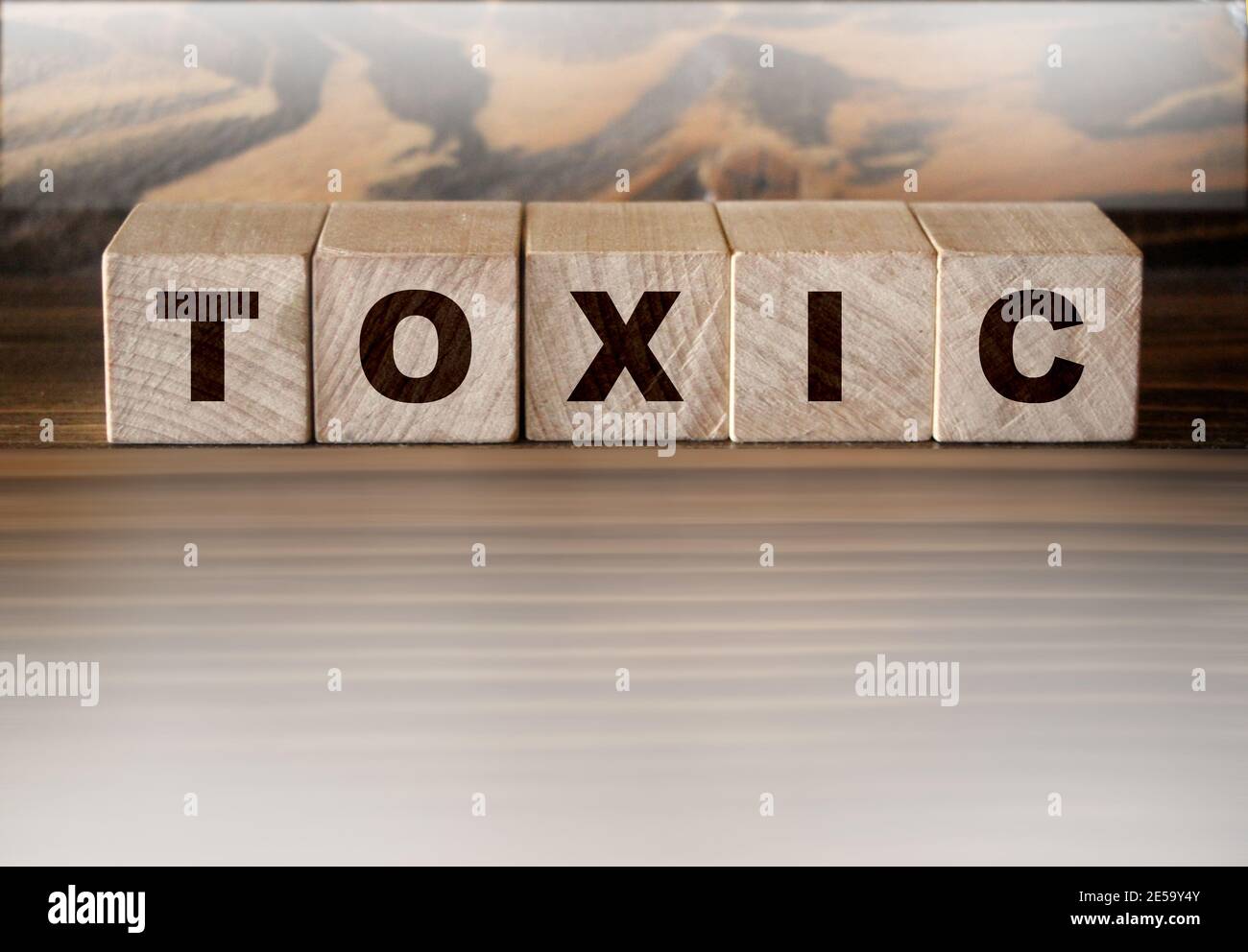 Toxic Word written on wooden cubes. Addiction concept Stock Photo - Alamy