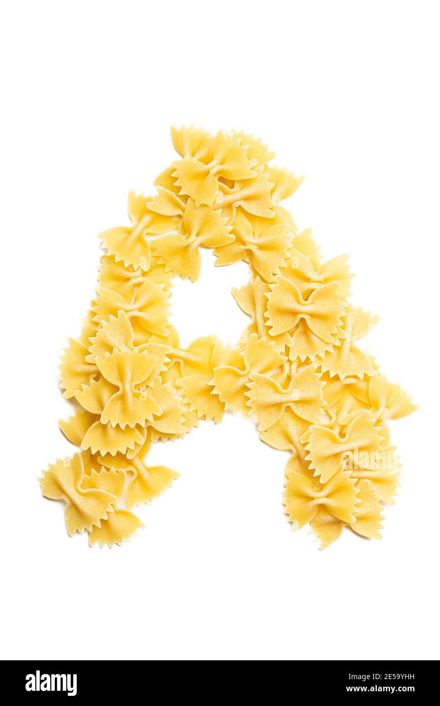 Letter A of the English alphabet from dry farfalle pasta on a white ...