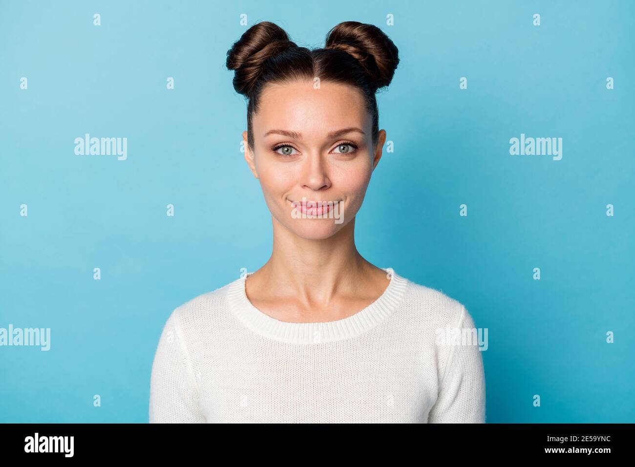 Photo of charming young girl two buns hairdo look camera wear white ...