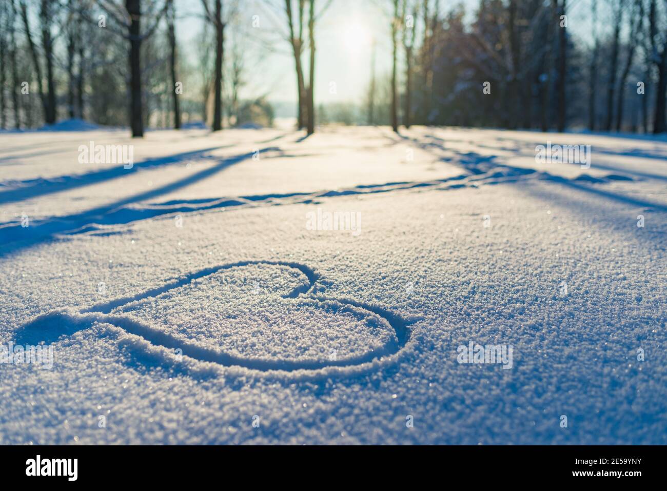 Drawn heart in a snow landscape.Winter evening sunset nice background ...
