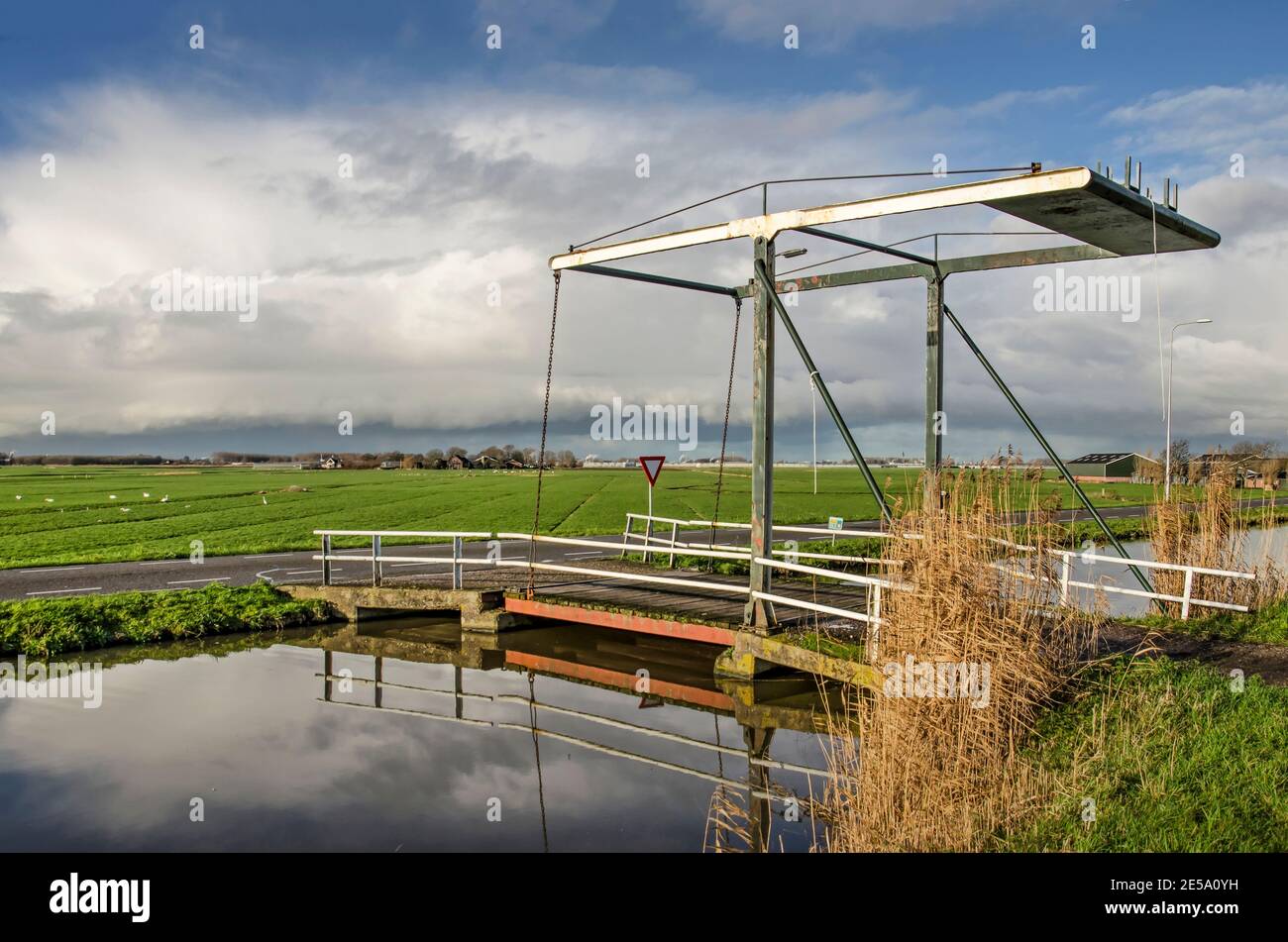 Steel drawbridge across a canal in the polder between Maasland and ...