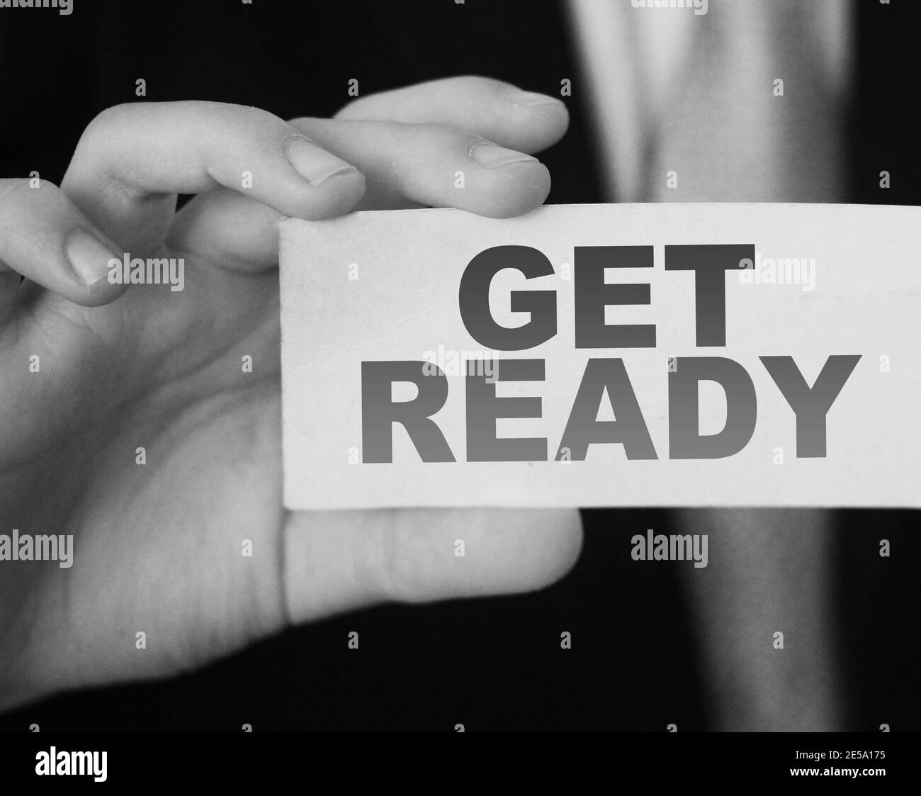 Get ready, message on business card shown by a businessman. Business ...