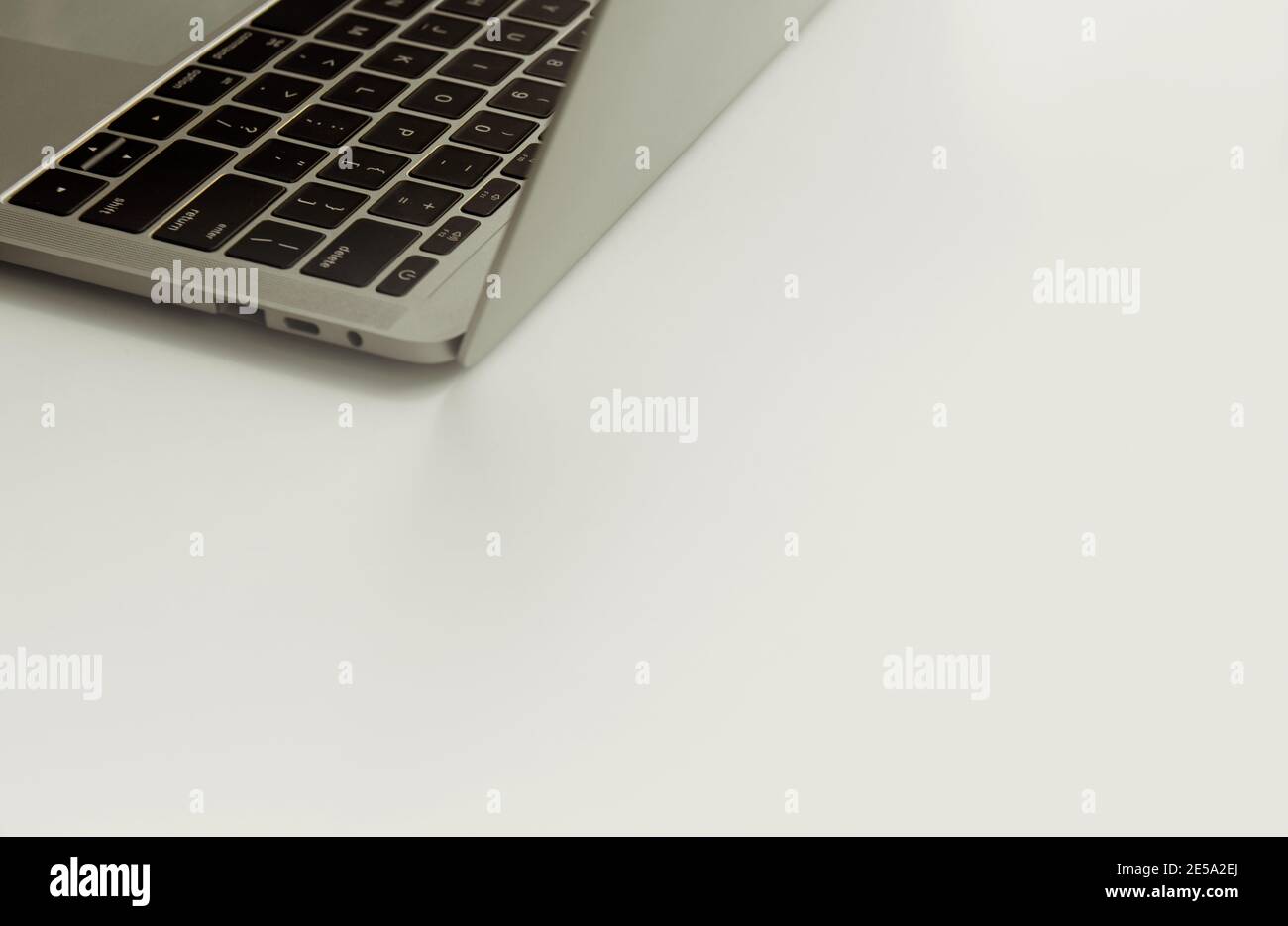 Laptop in angled position isolated on white background Stock Photo - Alamy