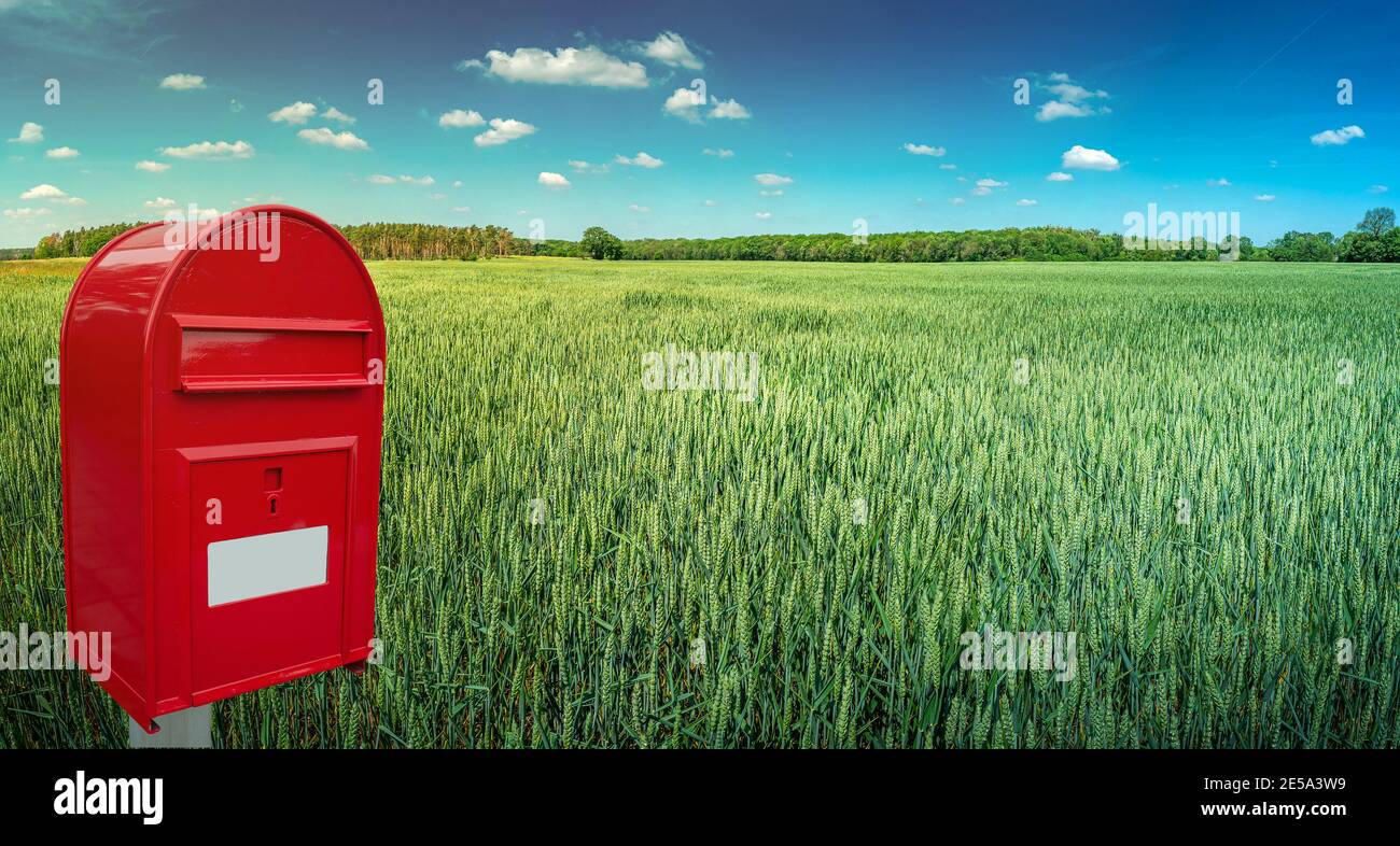 Big red modern postbox with white empty note space for address is ...