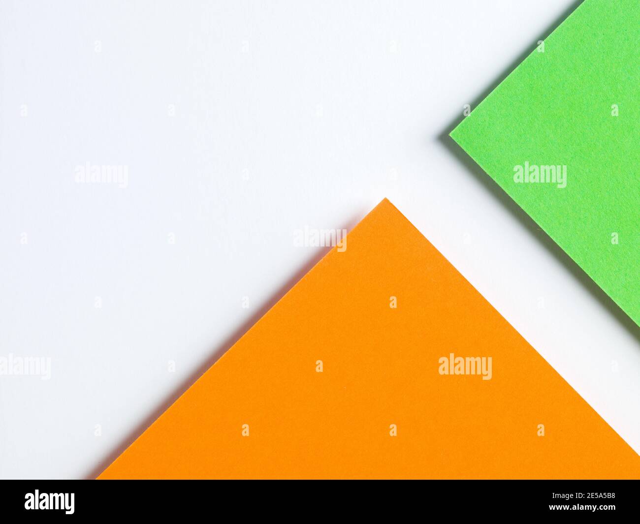 colored paper red an orange on white background Stock Photo - Alamy