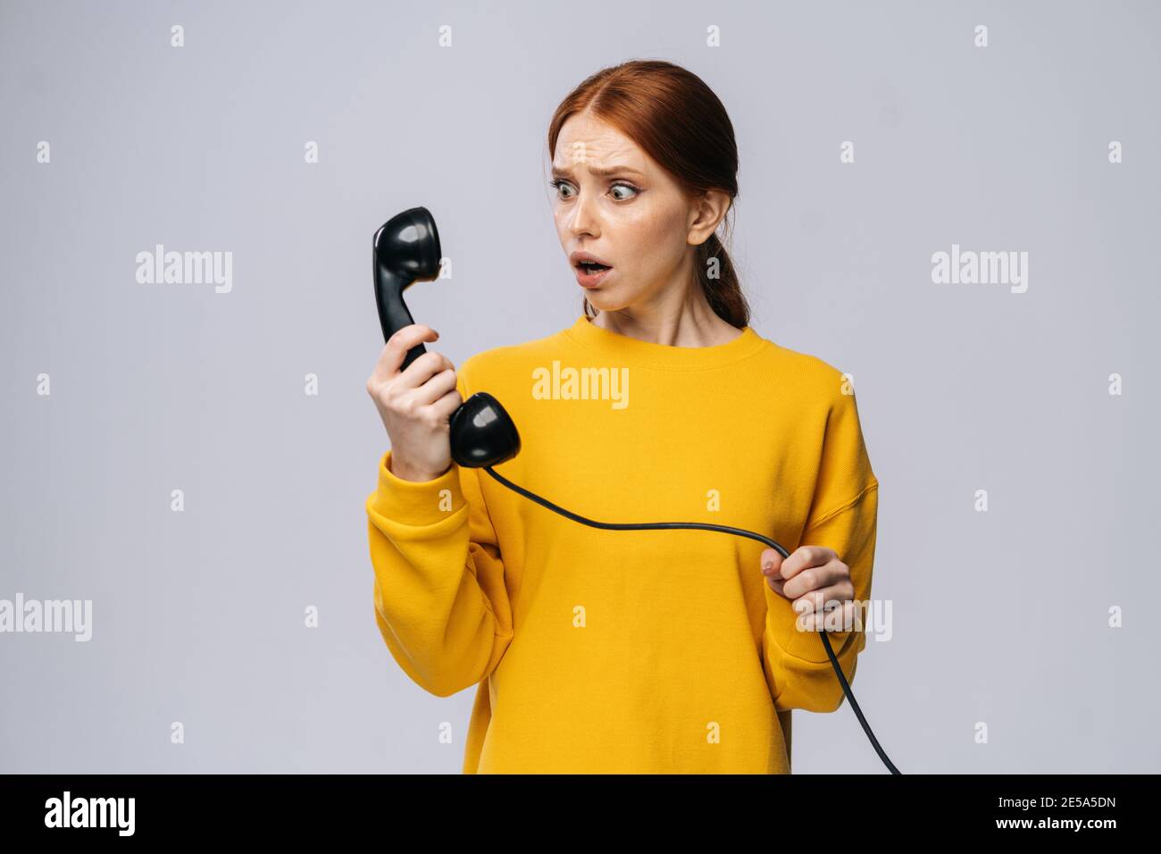 Woman landline scared hi-res stock photography and images - Alamy