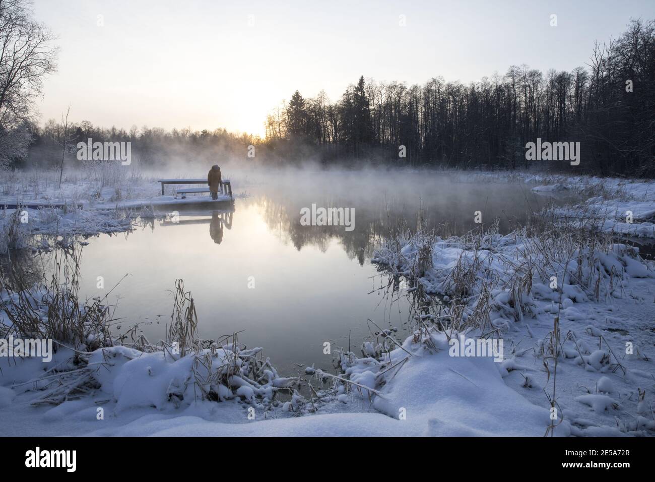 Woman on the bridge at the cold steaming groundwater spring Stock Photo ...