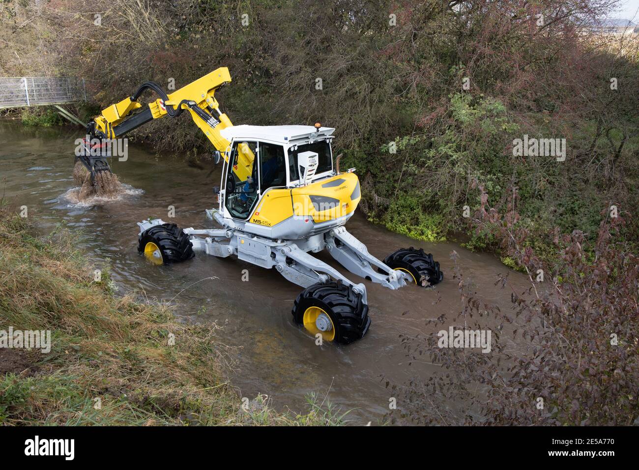 river renaturation, walking dredger cleans river bottom silted up by ...