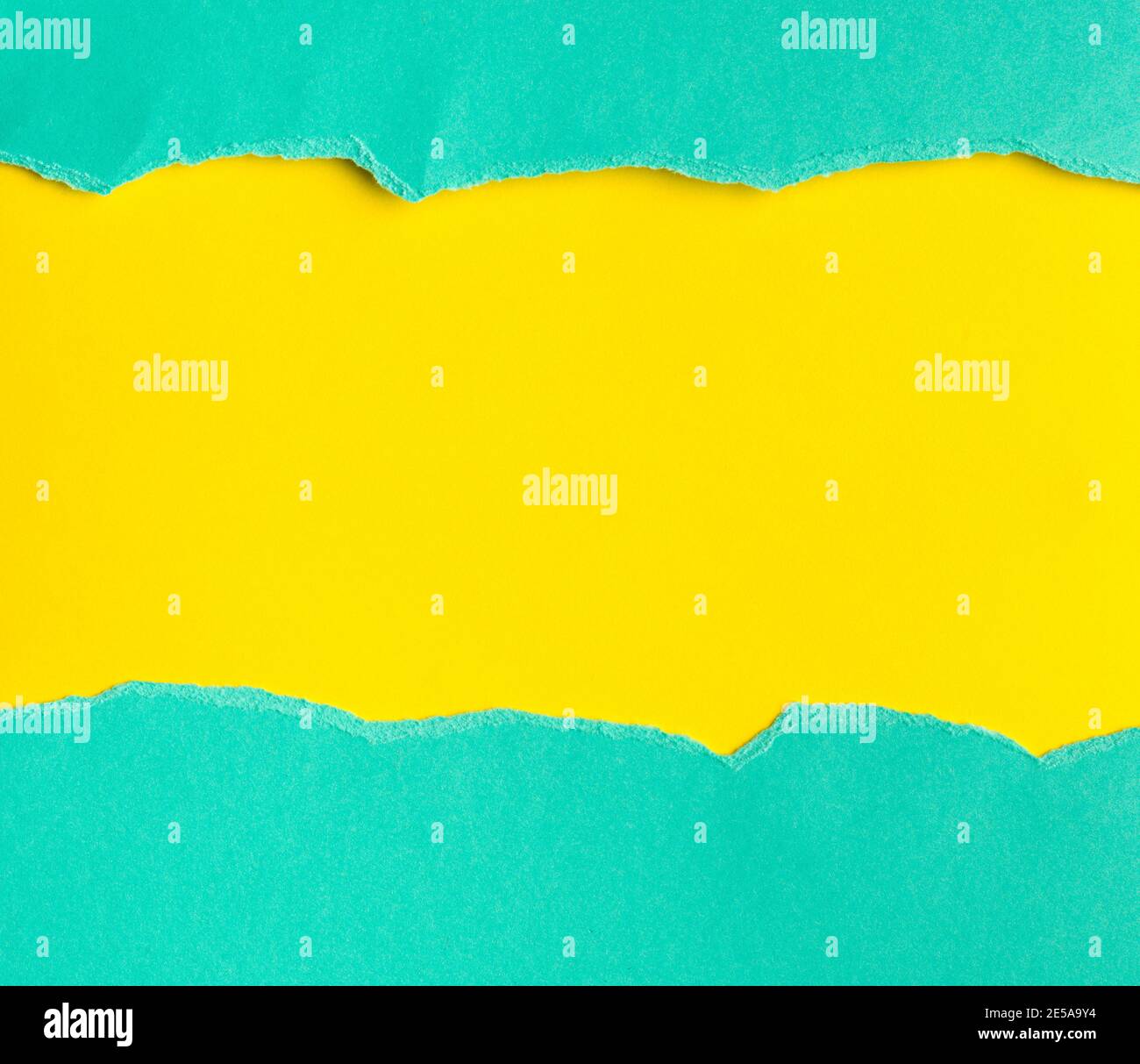 Upper and lower part of ripped open paper, aqua on yellow background ...