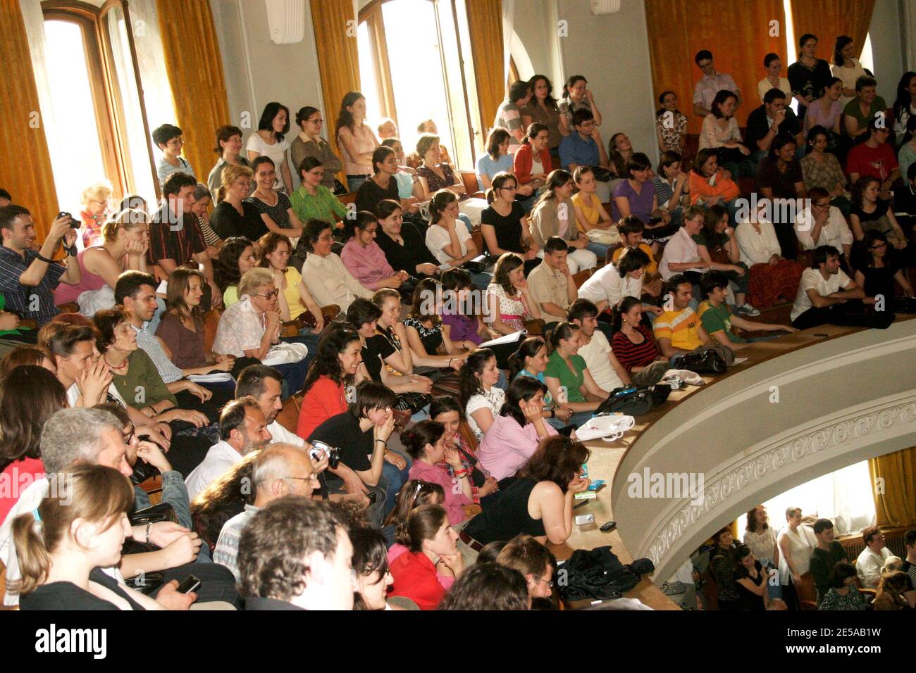 People in attendance at a public speaking event in Romania Stock Photo ...