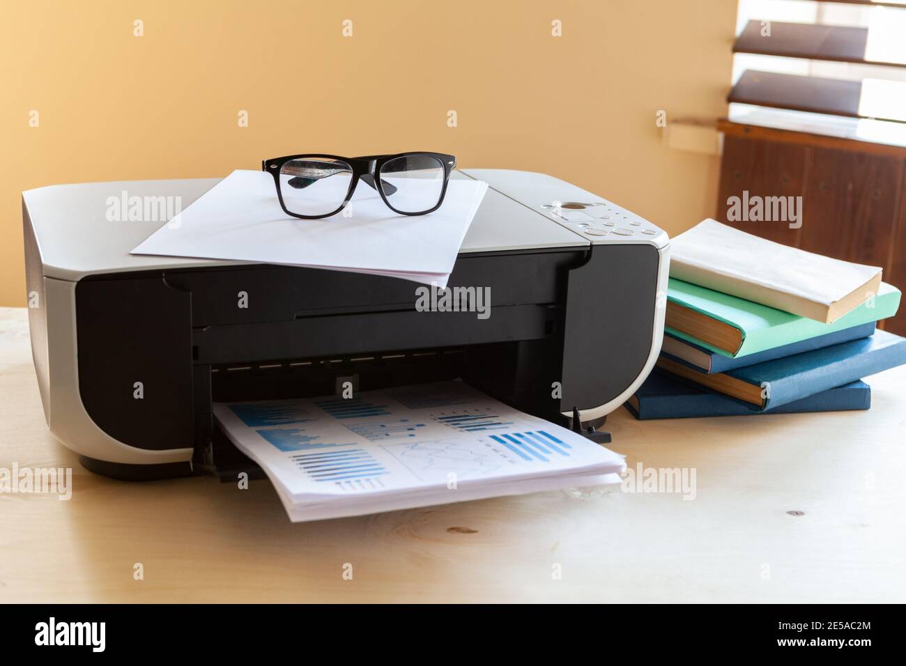 Close up of an office table with printer on it Stock Photo - Alamy