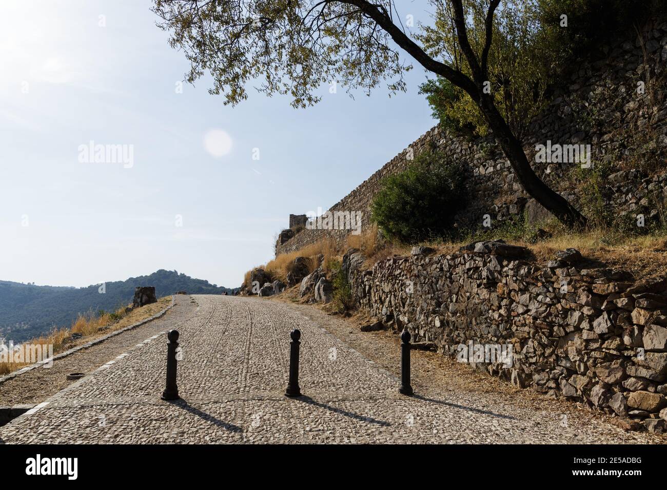 Road built from small rocks is closed for the vehicles with black ...