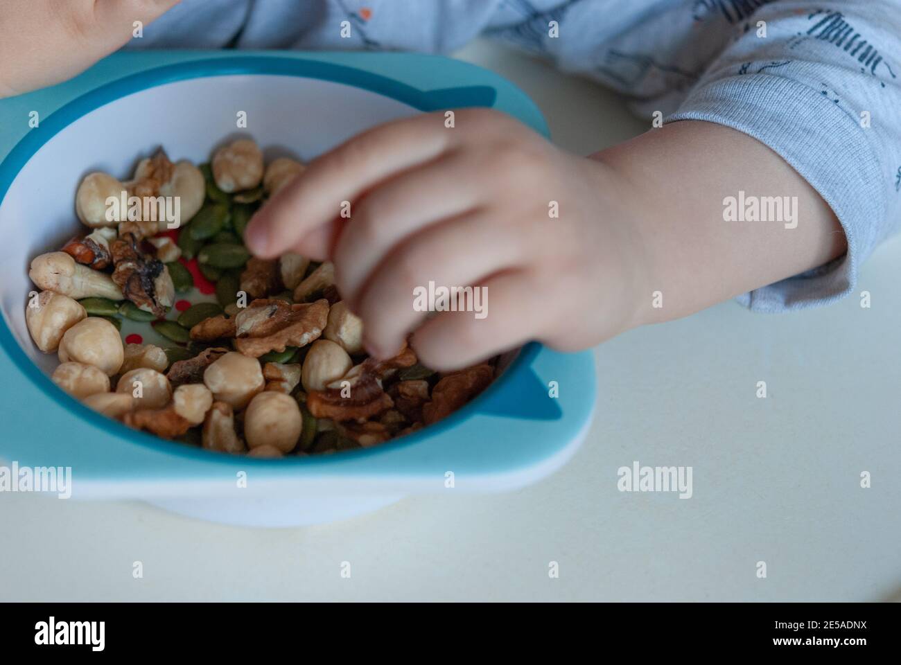 Child eating pumpkin seed hi-res stock photography and images - Alamy