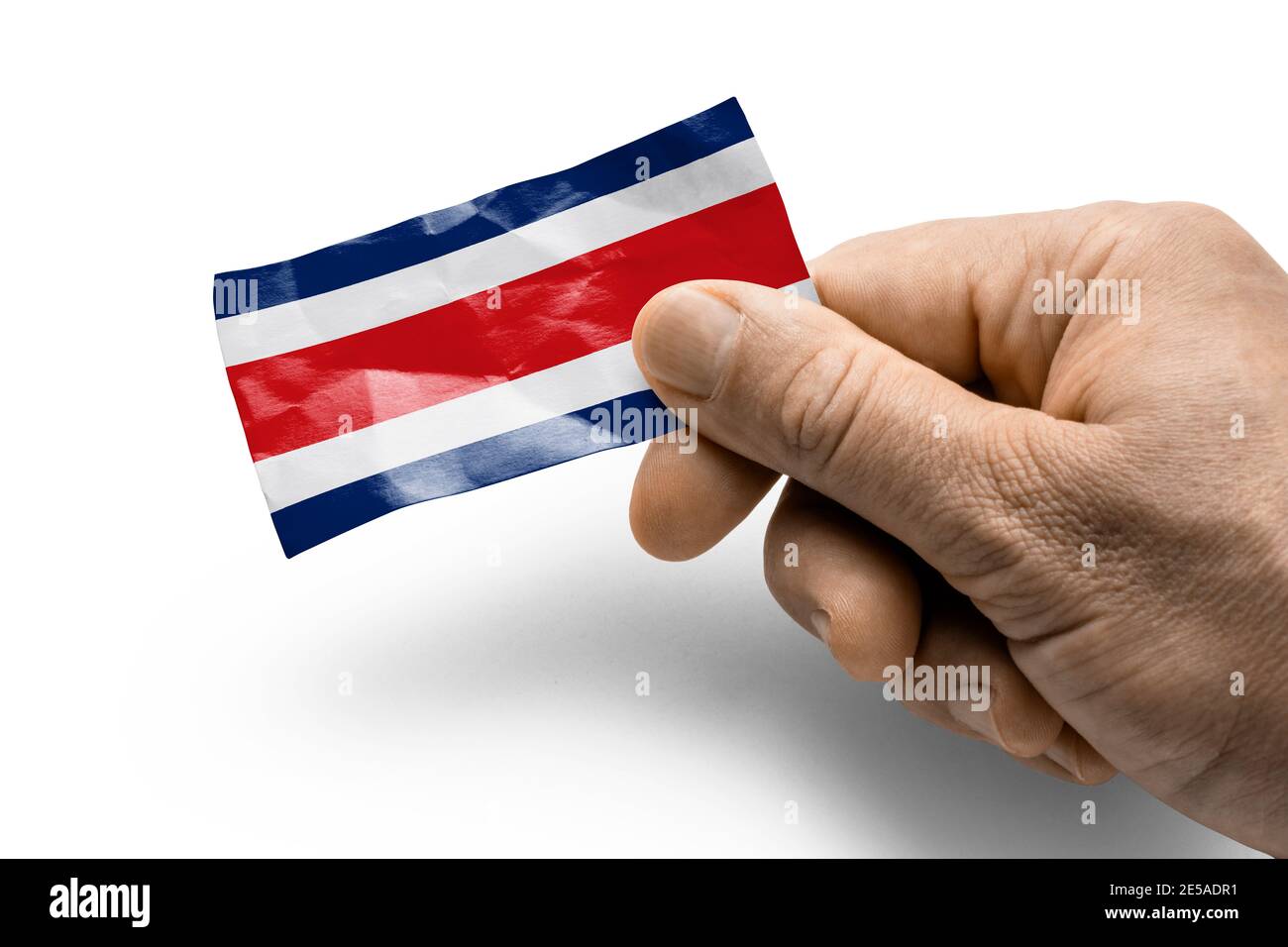 Hand holding a card with a national flag the Costa Rica Stock Photo - Alamy