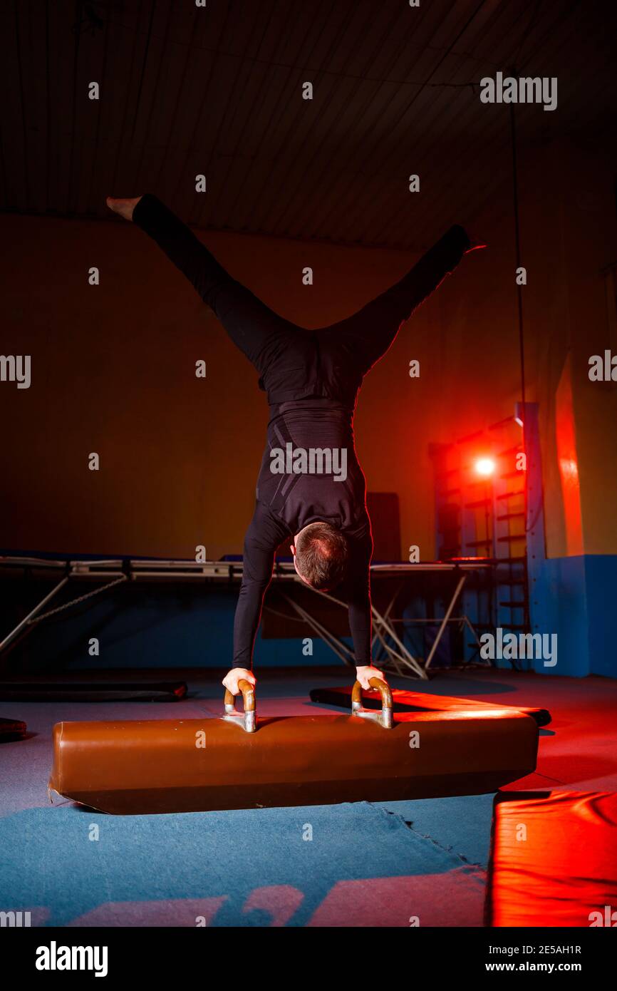 Muscular man doing handstand in hi-res stock photography and images - Alamy