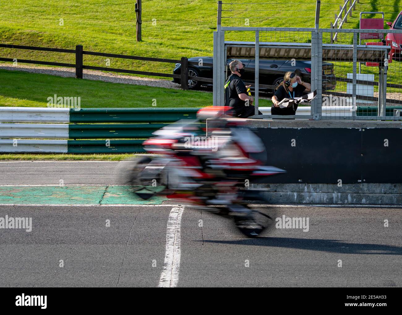 A shot of a racing motorbike as it crosses the finish line Stock Photo ...