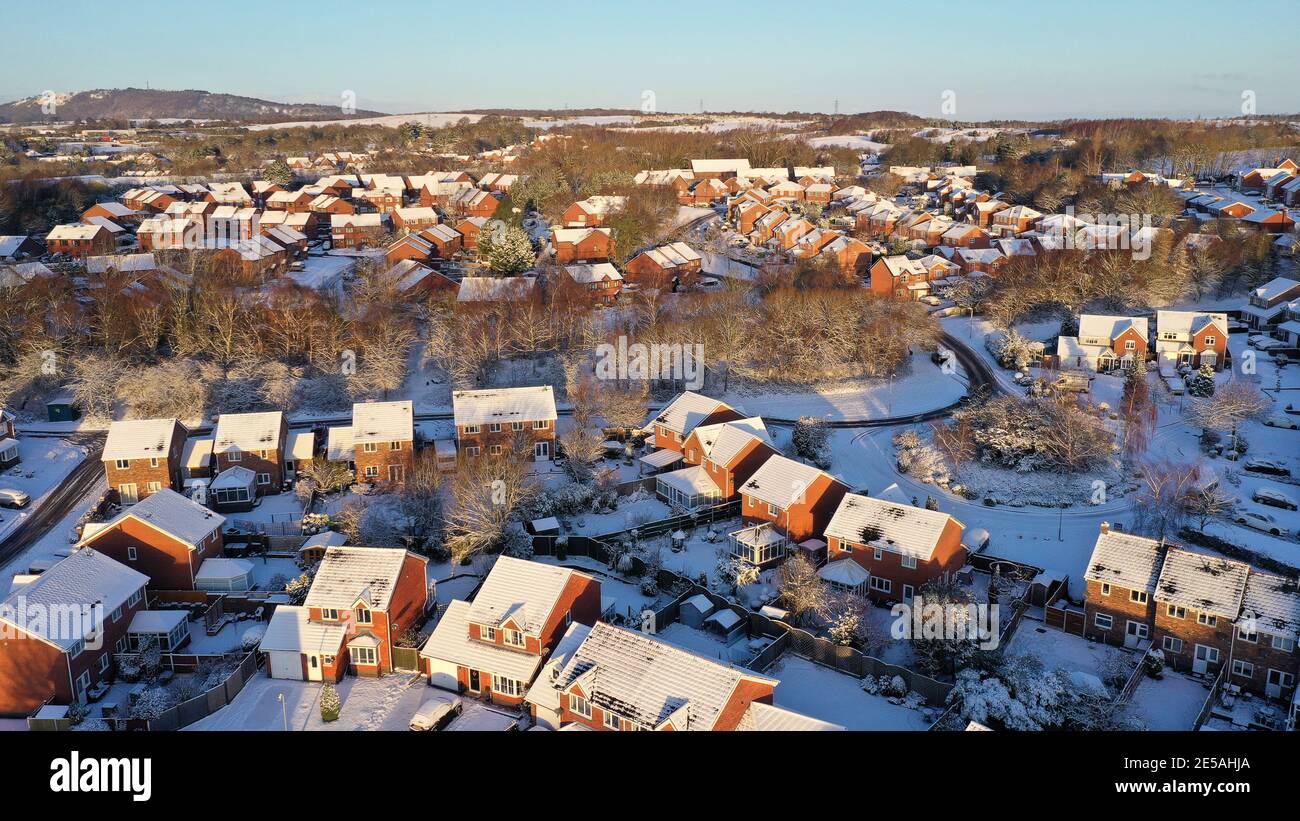 Aerial view modern housing estate with houses covered in snow at Lawley ...